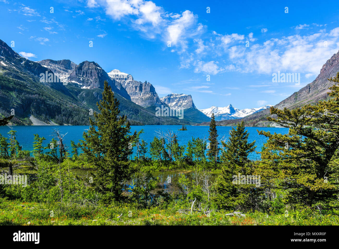 Spring at Saint Mary Lake - A panoramic view of high clouds passing ...