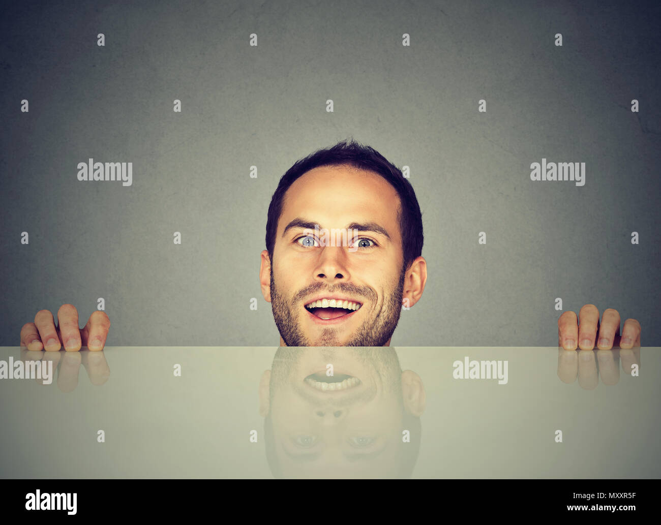 Hiding behind table hi-res stock photography and images - Alamy