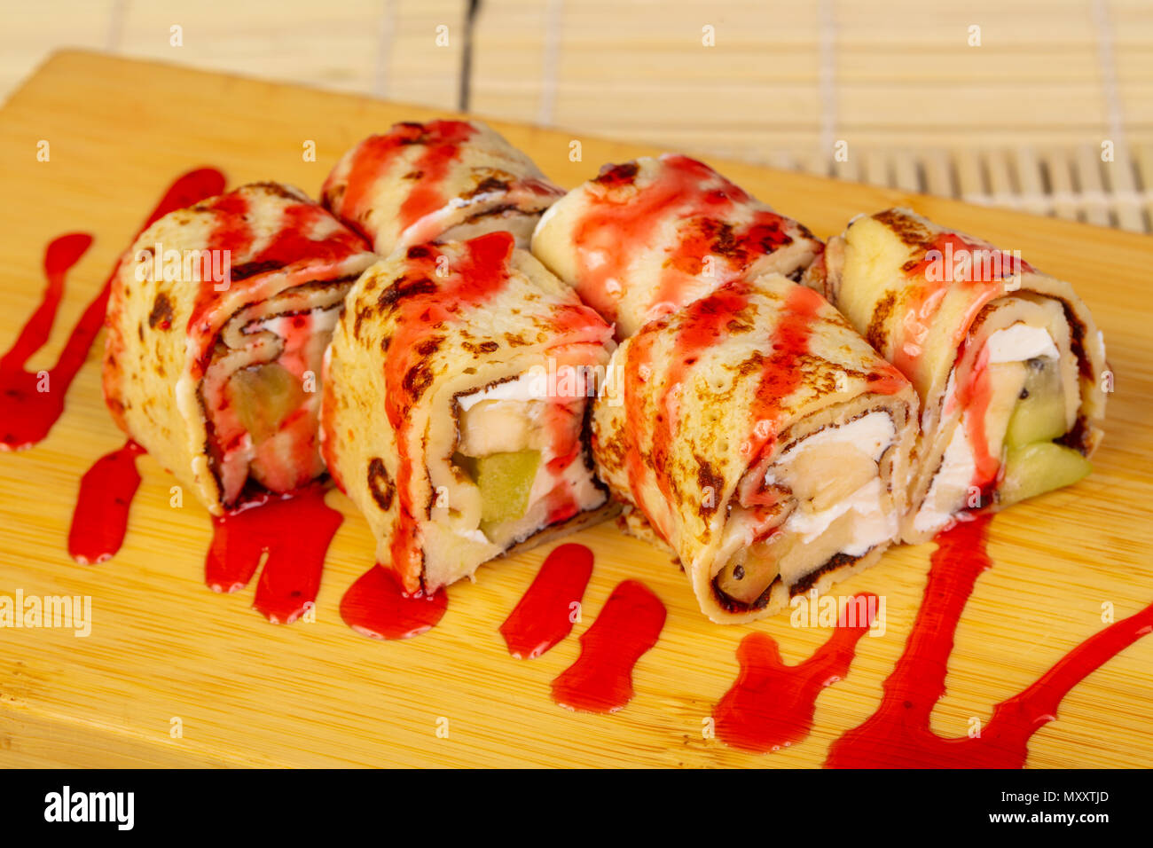 Sweet creamy rolls with jam Stock Photo - Alamy