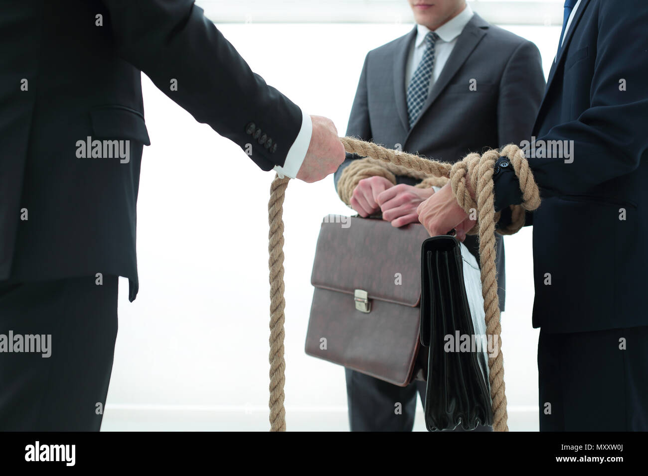 close up.business leader pulls related employees Stock Photo - Alamy