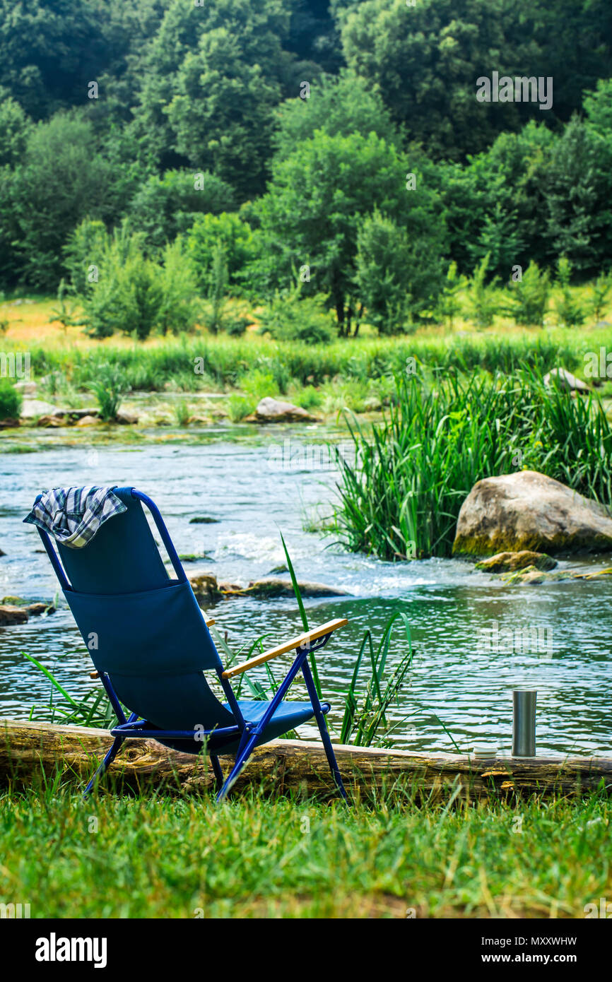 chair for camping on the river Bank, camping Stock Photo - Alamy