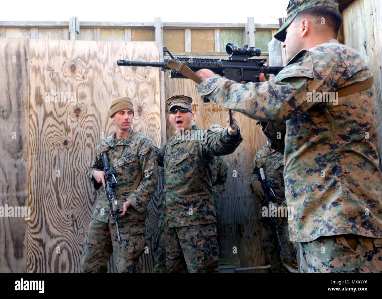 Staff Sgt. Travis A. Musto (center) walks his personnel safety officers ...