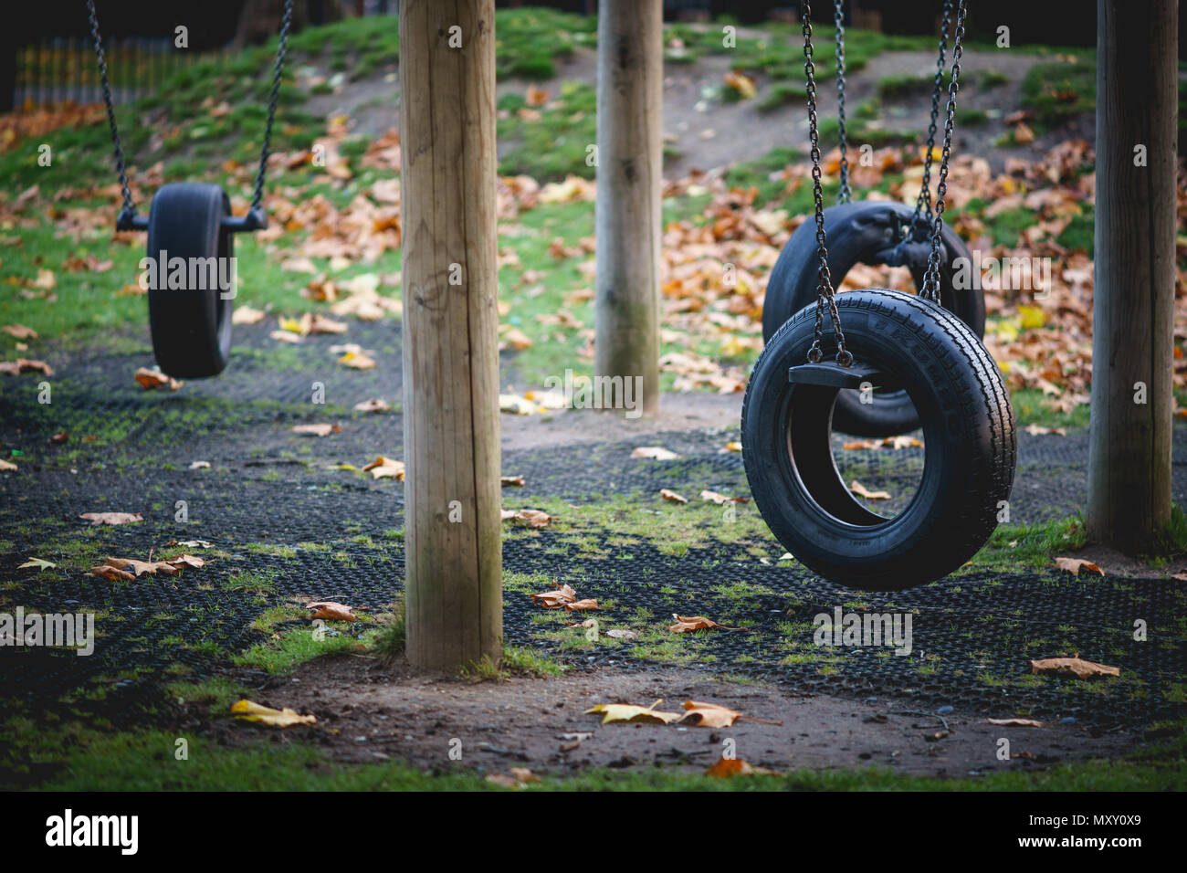 London, UK - October 2017. Empty tyre swings in the playground of Hilly ...