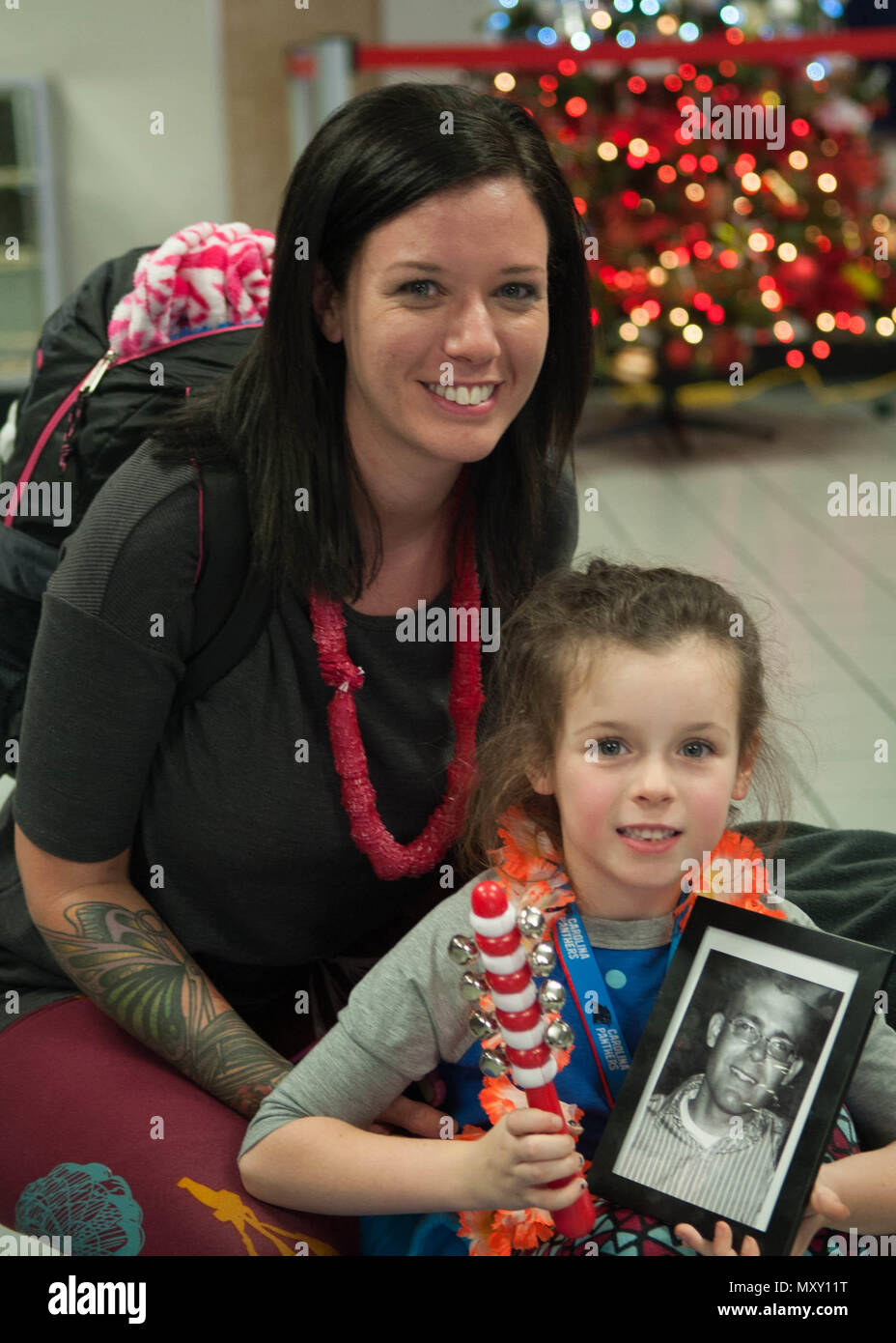 Brayden Hicks and mother Kimberly Hicks, pose with a photo of Spc. Seth ...
