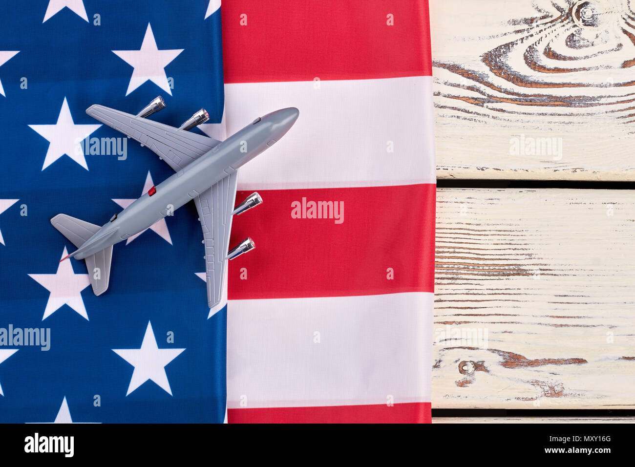 Flag of USA and toy air plane. Plastic toy jet plane and american flag ...