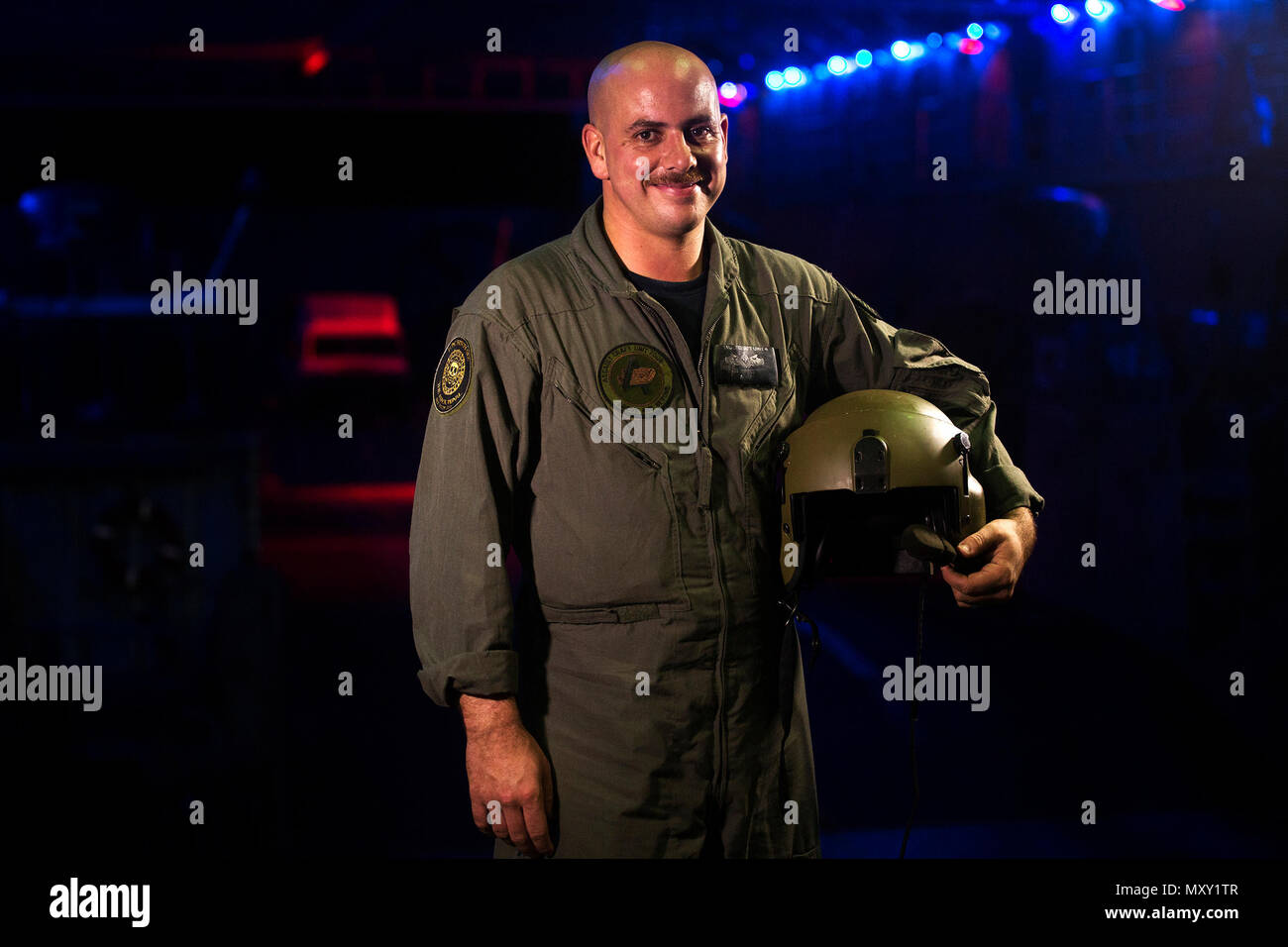 Petty Officer 2nd Class Anthony Pacitto poses for a photo in front of ...
