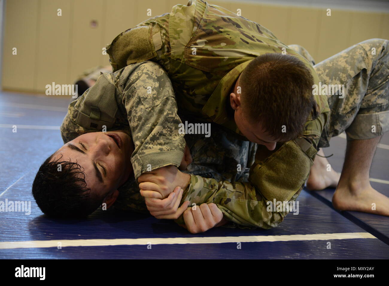 U.S. Army Spc.Travis Inglis, grabs Pfc.Andrew McDaniel's hand as they ...