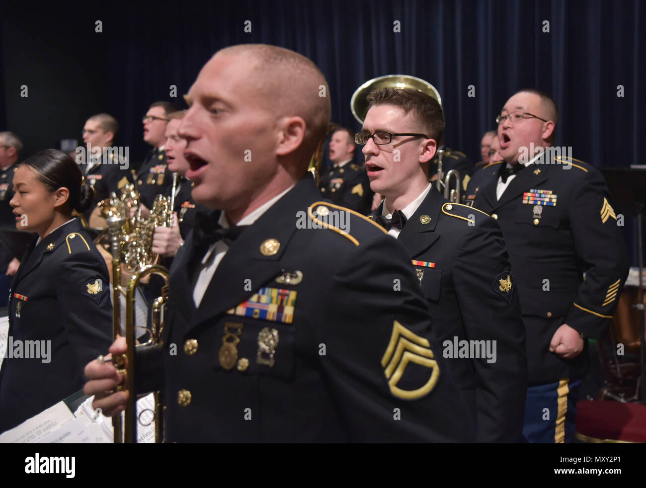 U.S. Army Staff Sgt. Lee Beauchamp sings The Army Song with other ...