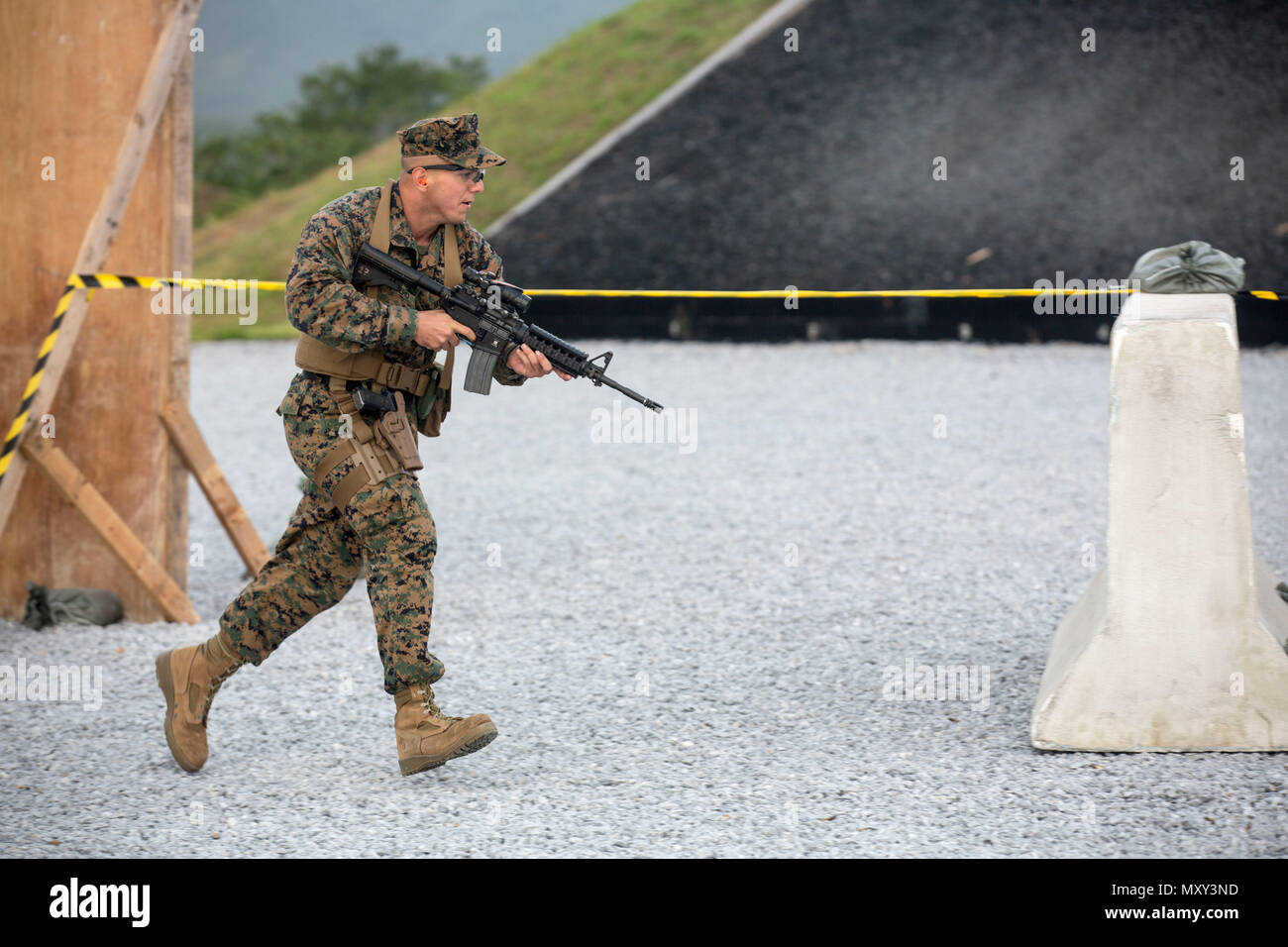 U.S. Marine SSgt. Kidany Vaquero with Marine Forces Reserves advances ...