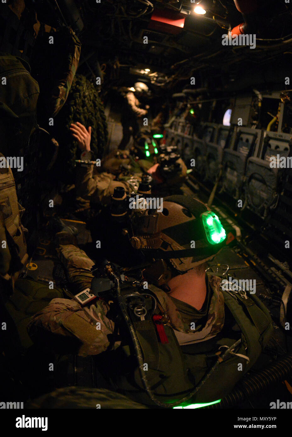 Four members of the 321st Special Tactics Squadron prepare to conduct a ...