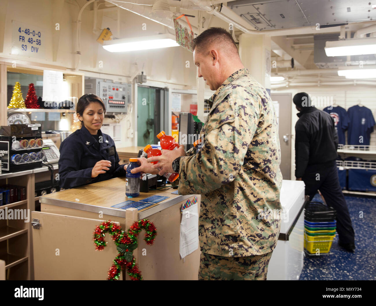 Petty Officer 3rd Class Frances Chairez (left), a ship serviceman with ...