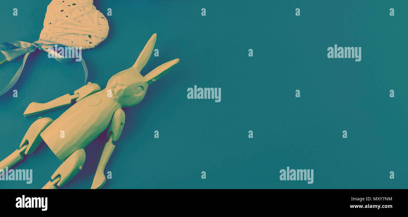 Banner Surrealism composition vintage wooden rabbit on dark blue ...