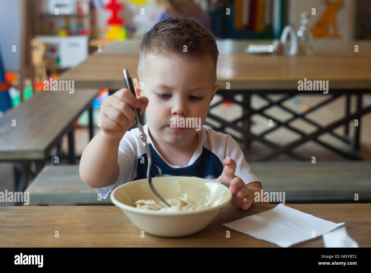 Blonde boy diner hi-res stock photography and images - Alamy