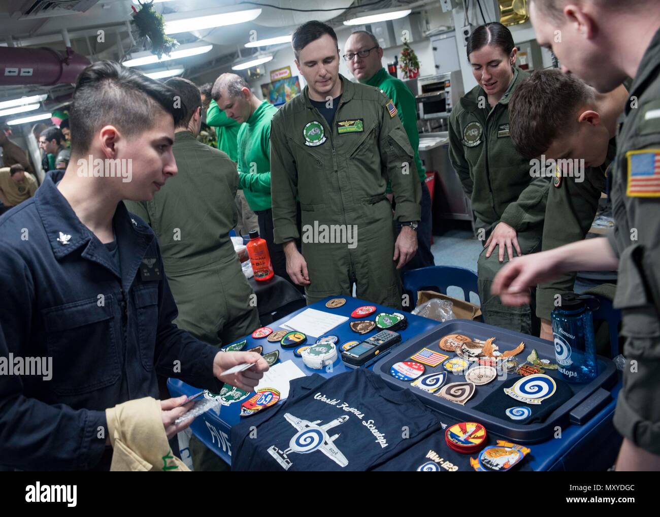 161222-N-ZJ713-021 ATLANTIC OCEAN (Dec. 22, 2016) Sailors browse wares ...