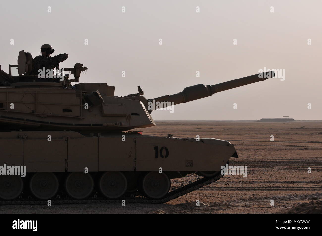 M1A2 Abrams Main Battle Tanks move to engage targets during a joint ...