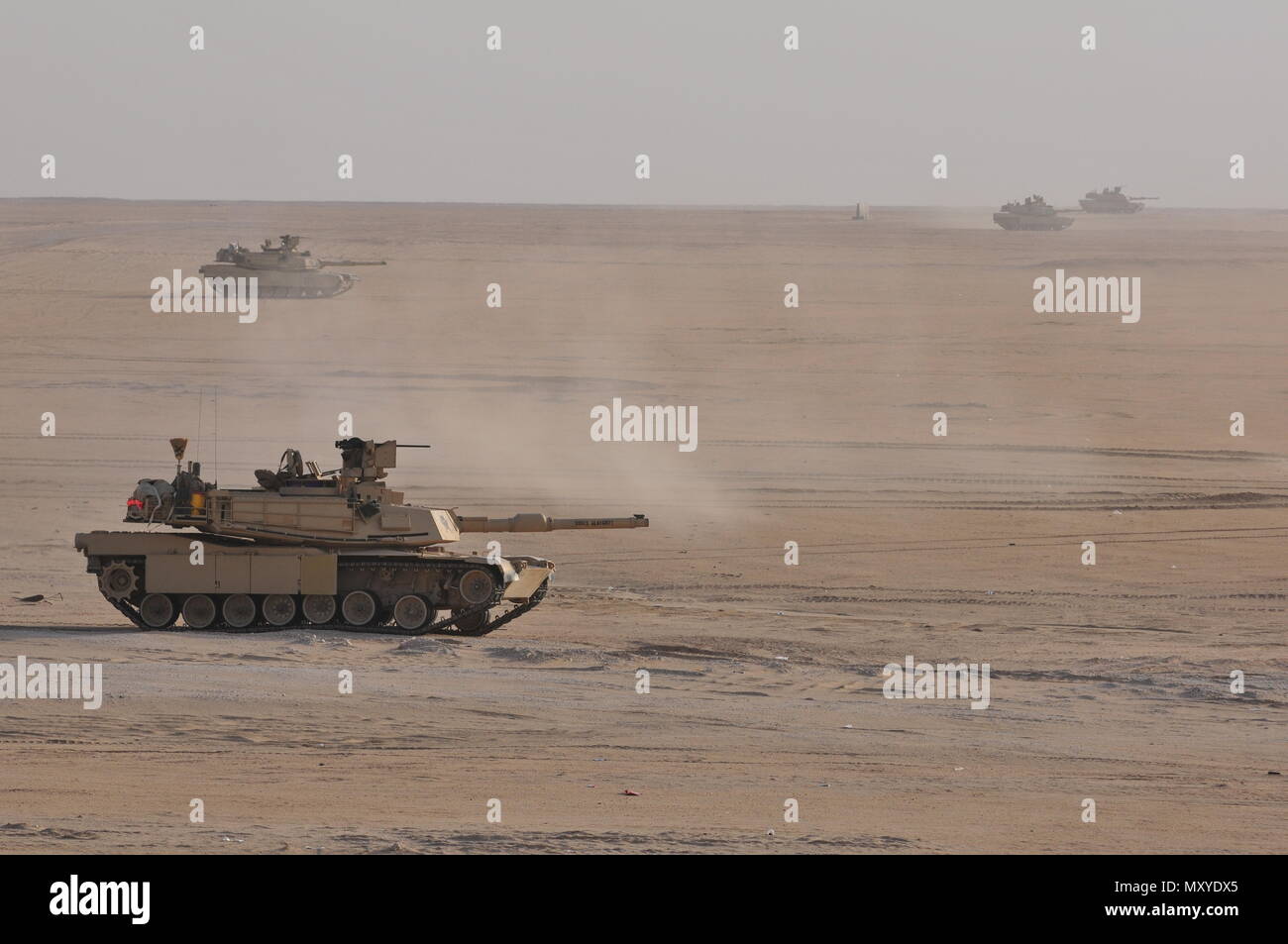 M1A2 Abrams Main Battle Tanks move to engage targets during a joint ...