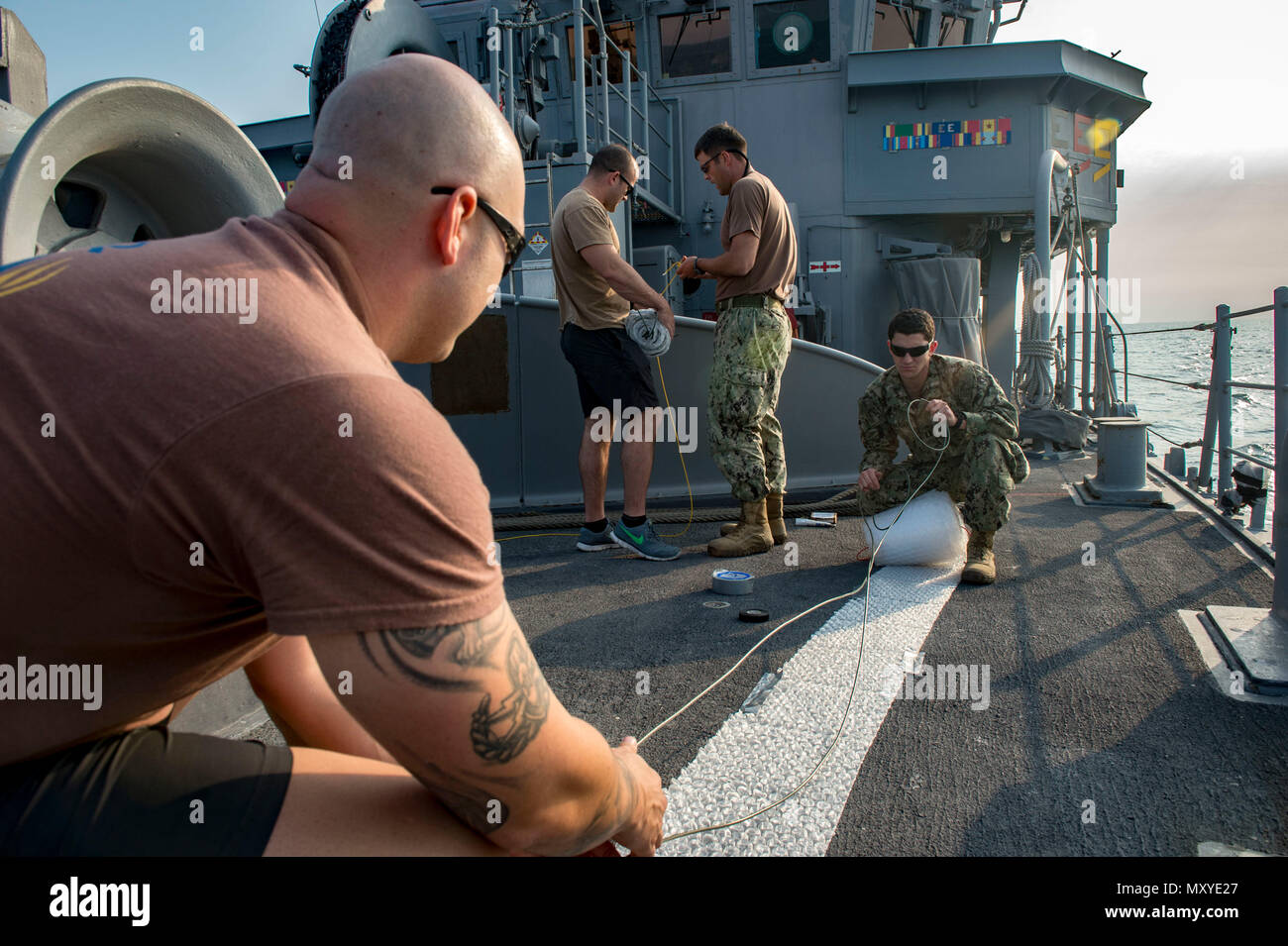From left, Petty Officer 2nd Class Bryce Hopkins and Lt. j.g. Lawrence ...