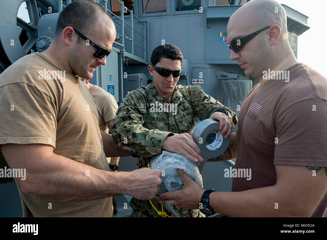 From left, Petty Officer 3rd Class Cullen Brungs, Lt. j.g. Lawrence ...