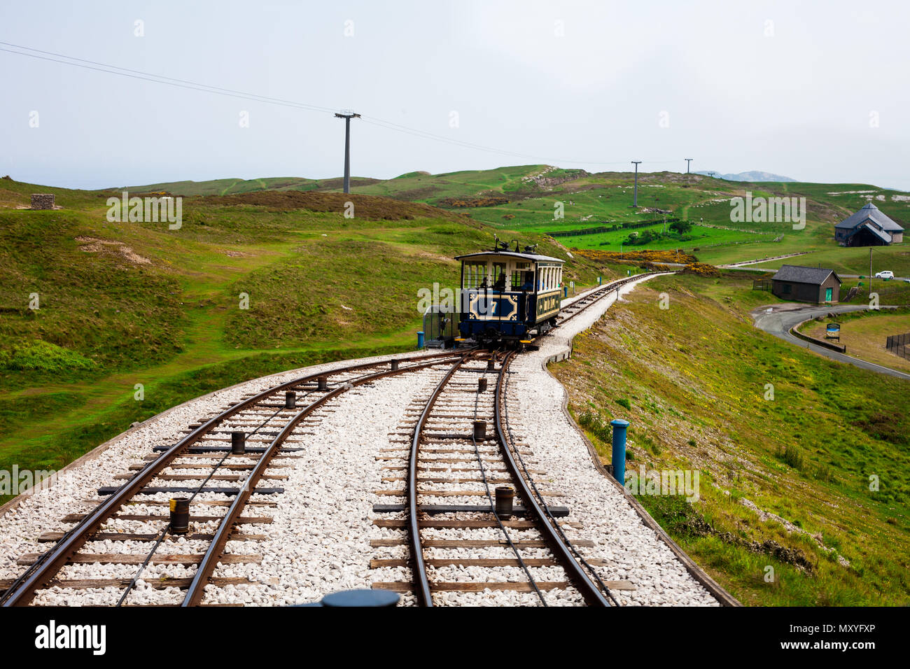 Old blue vintage tramway getting on devided railway. Tram choosing it's ...