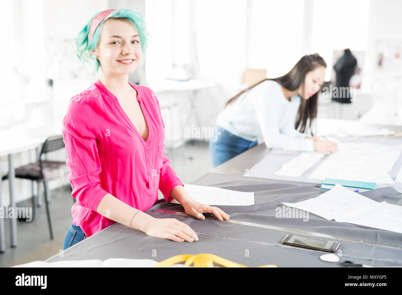 Female artist looking at sketches hi-res stock photography and images ...