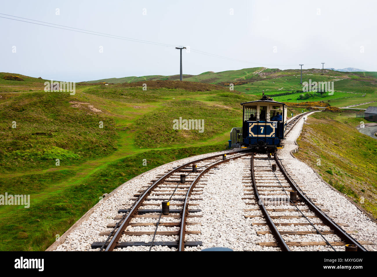 Old blue vintage tramway getting on devided railway. Tram choosing it's ...