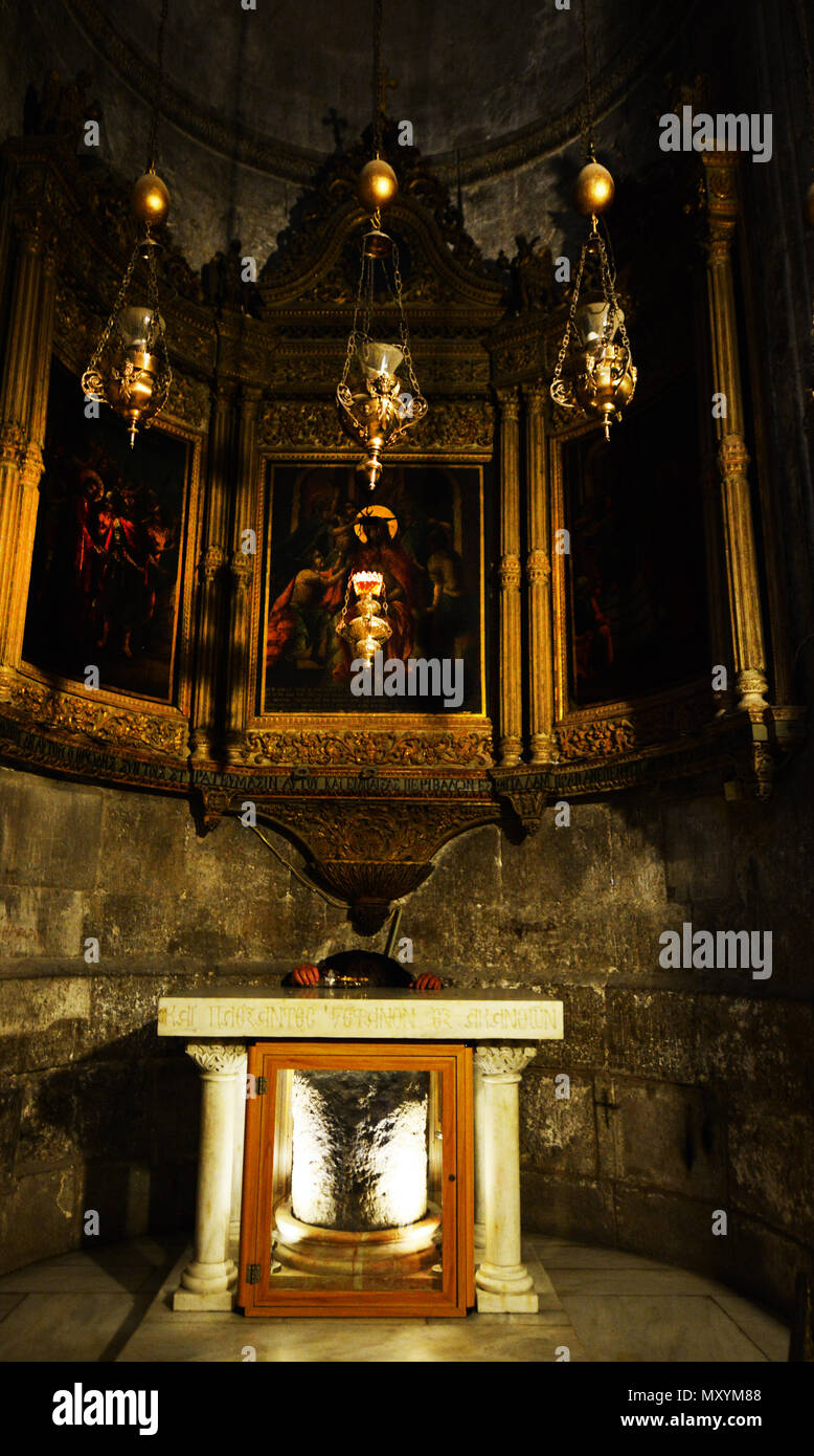 A Russian Orthodox man praying in a chapel inside the church of the ...