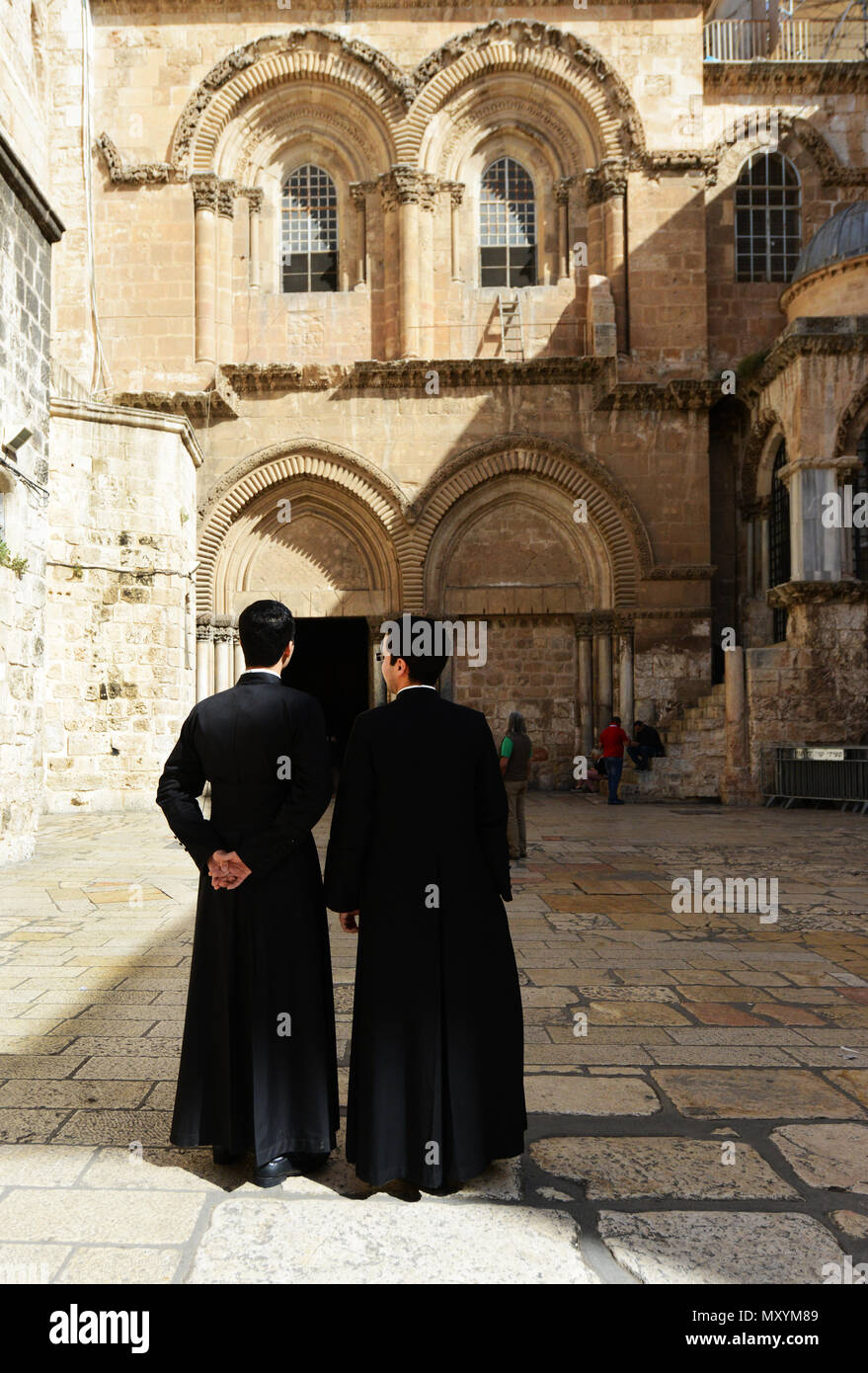 Catholic priest standing outside the church of the holy Sepulchre in ...