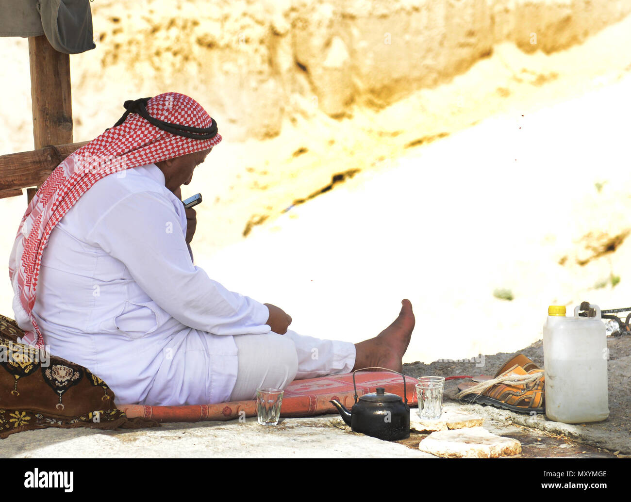 A traditionally dressed Bedouin man in the Judaean desert in Israel ...