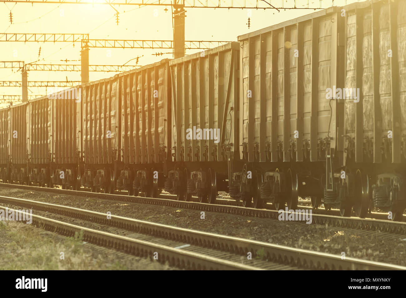 railroad cars at sunset, side view, tinted Stock Photo - Alamy