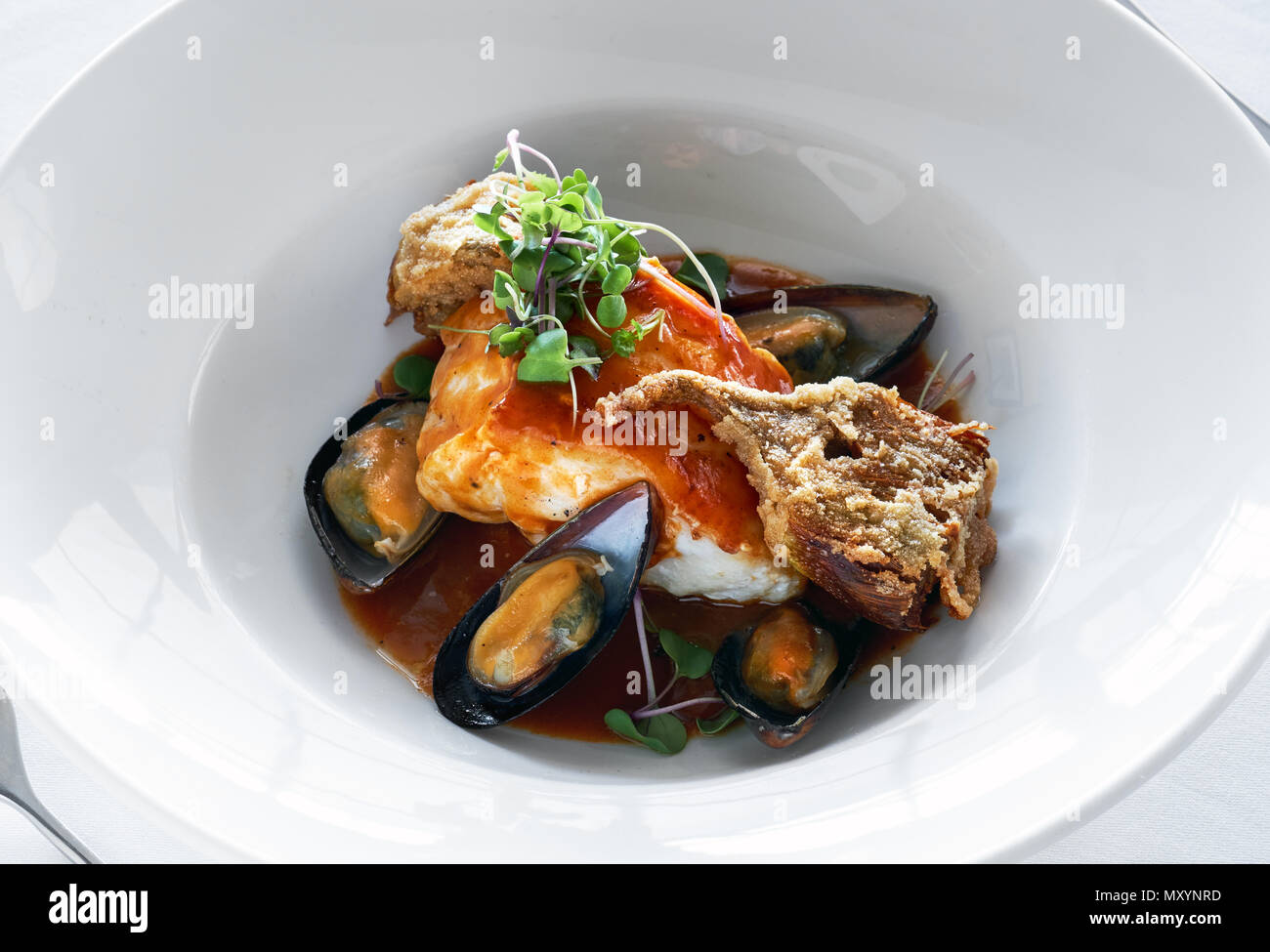 Sea devil with mussels Stock Photo - Alamy
