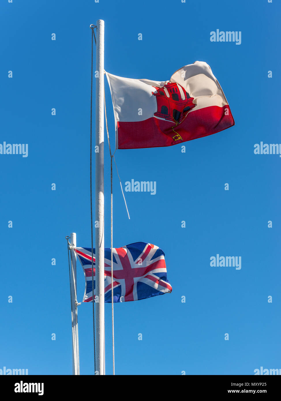 Flags of the Gibraltar and United Kingdom on the Rock of Gibraltar ...