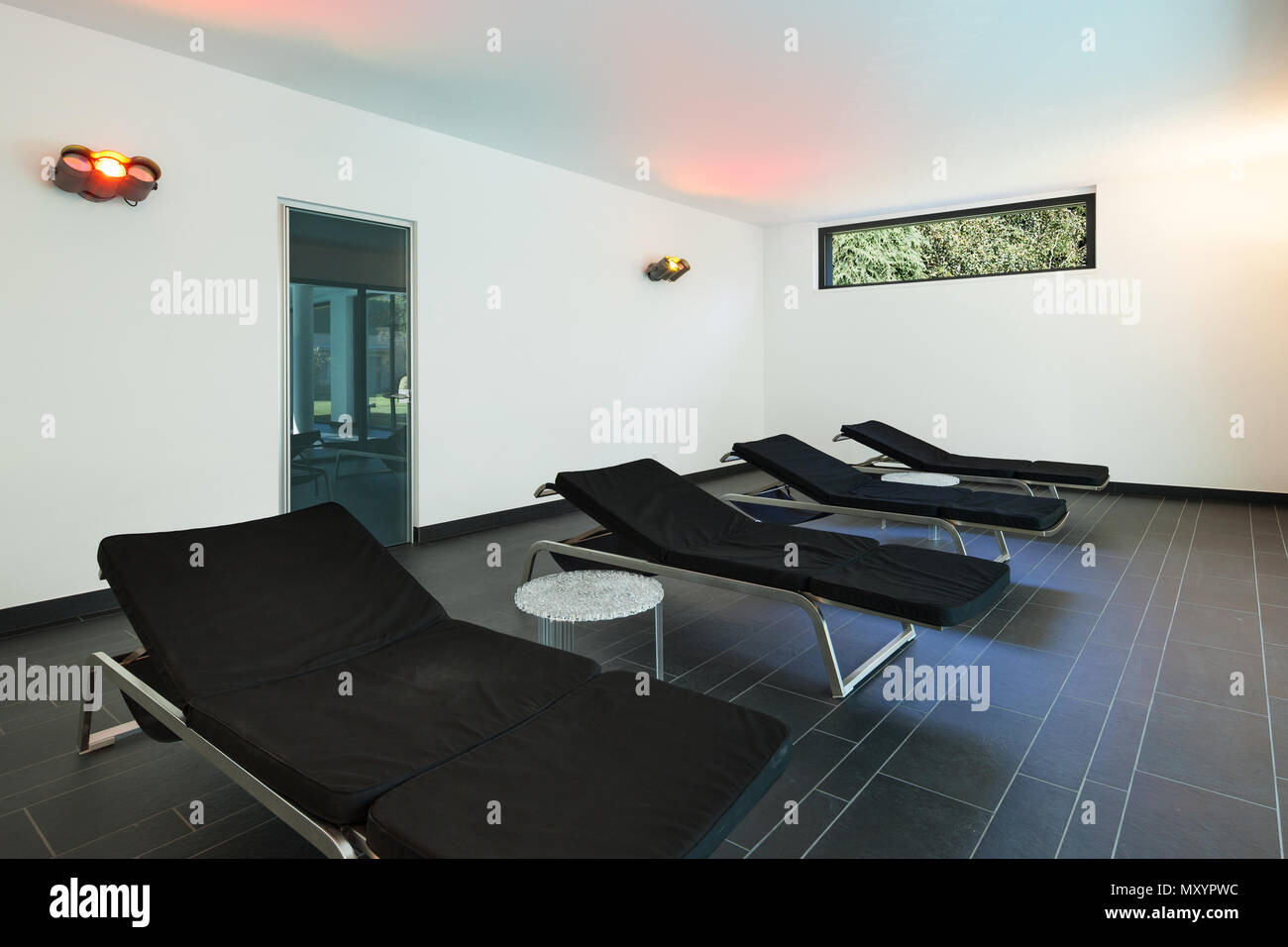 interior of a modern spa, room with sunbeds Stock Photo - Alamy