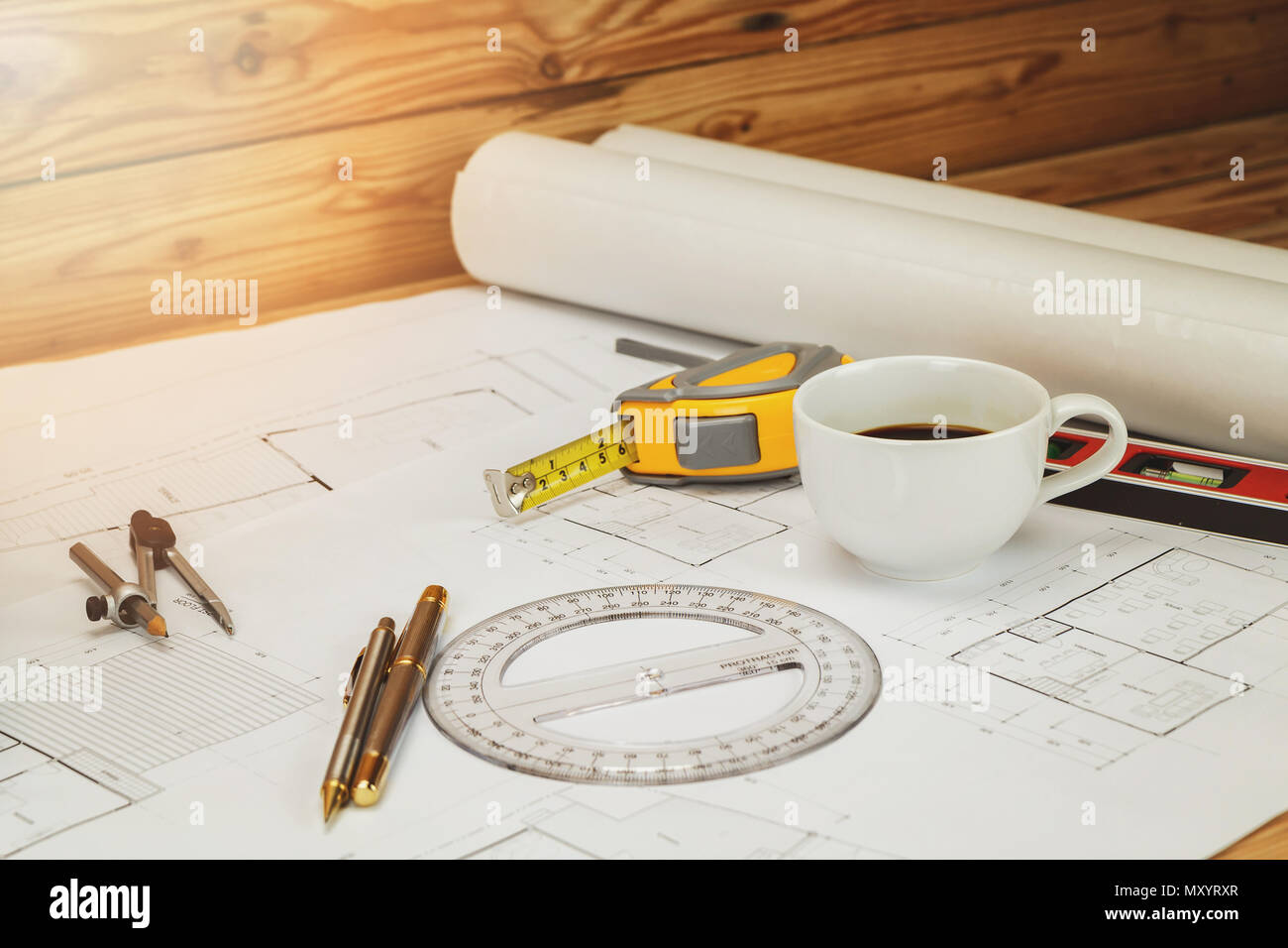 Cup of coffee with measurement tool and blueprint, architectural ...