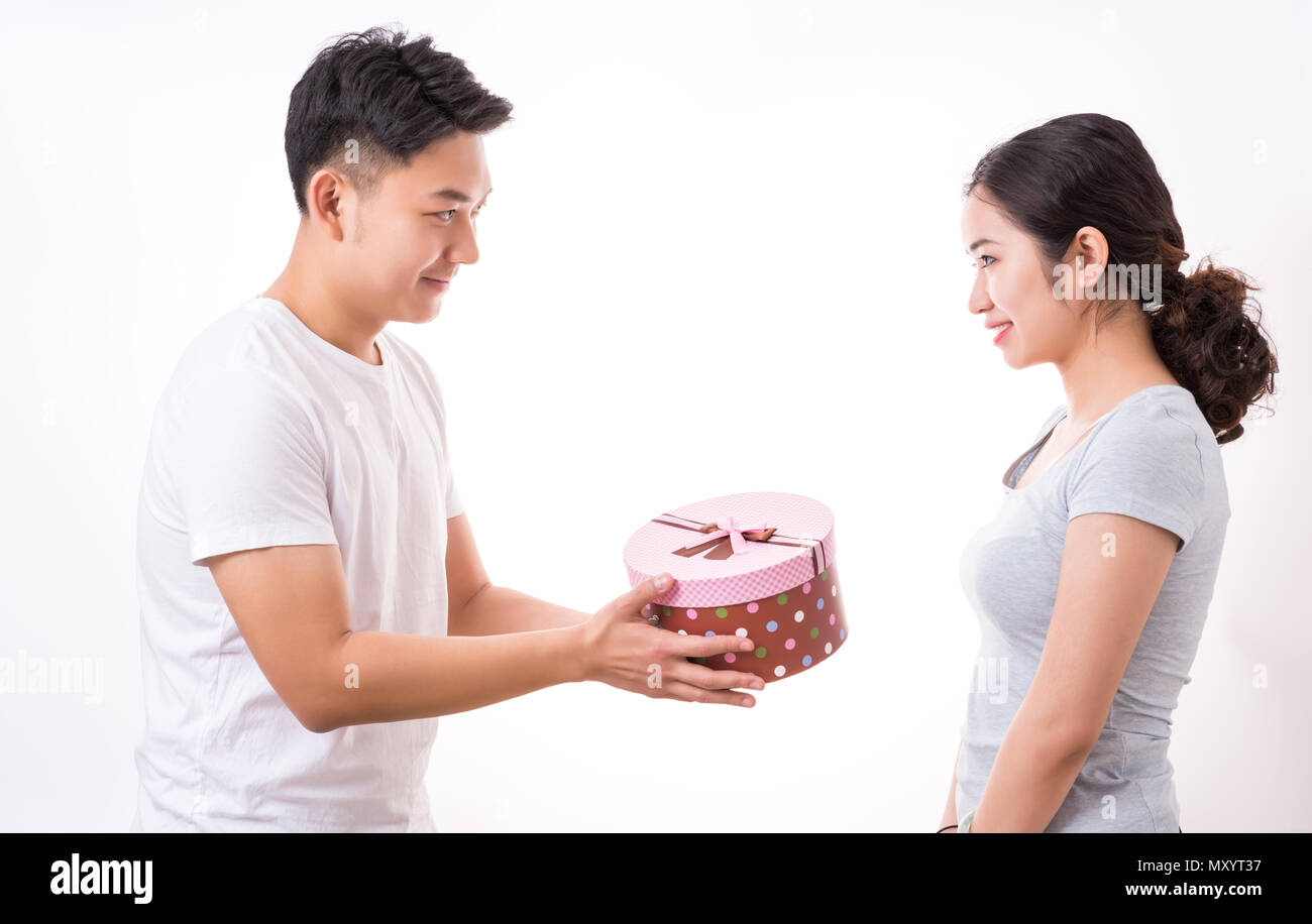 Man giving woman gift. Man handing woman gift. Hand, love Stock Photo ...