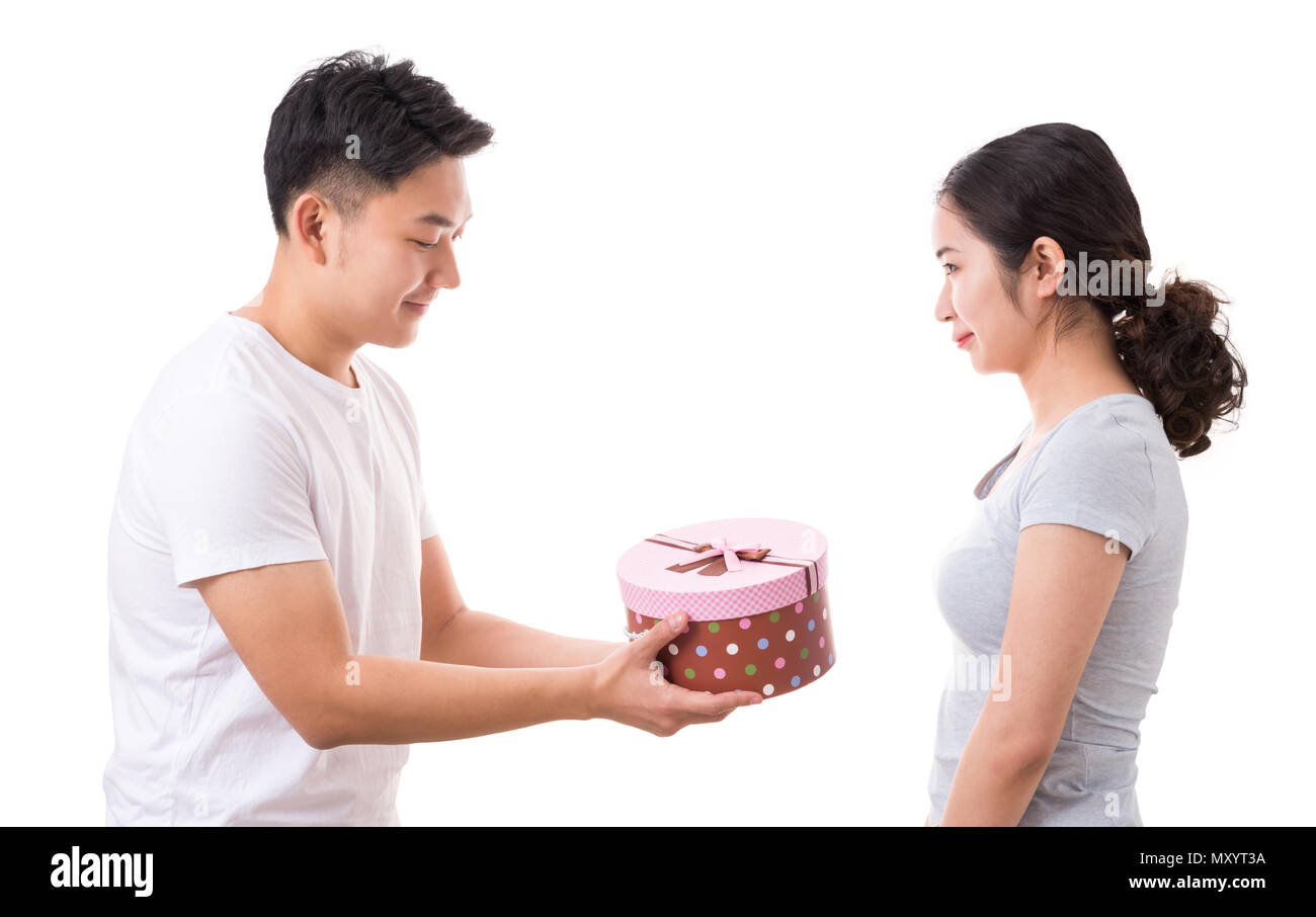 Man giving woman gift. Man handing woman gift. Hand, love Stock Photo ...