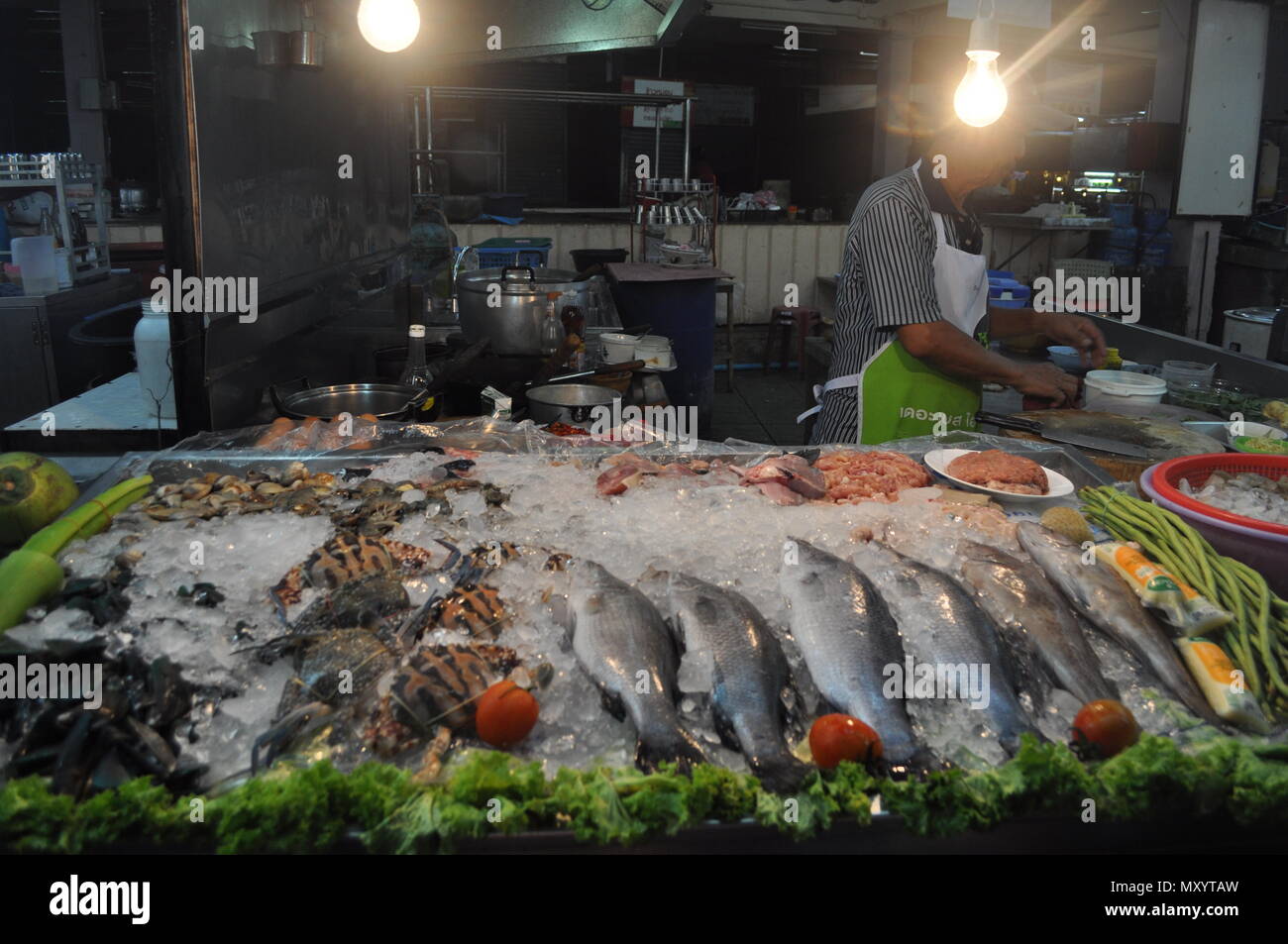 Fish and seafood food stand on night market, Thailand Stock Photo - Alamy