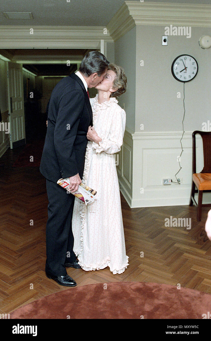 10-21-1987 President Reagan kissing Nancy Reagan while visiting her at ...