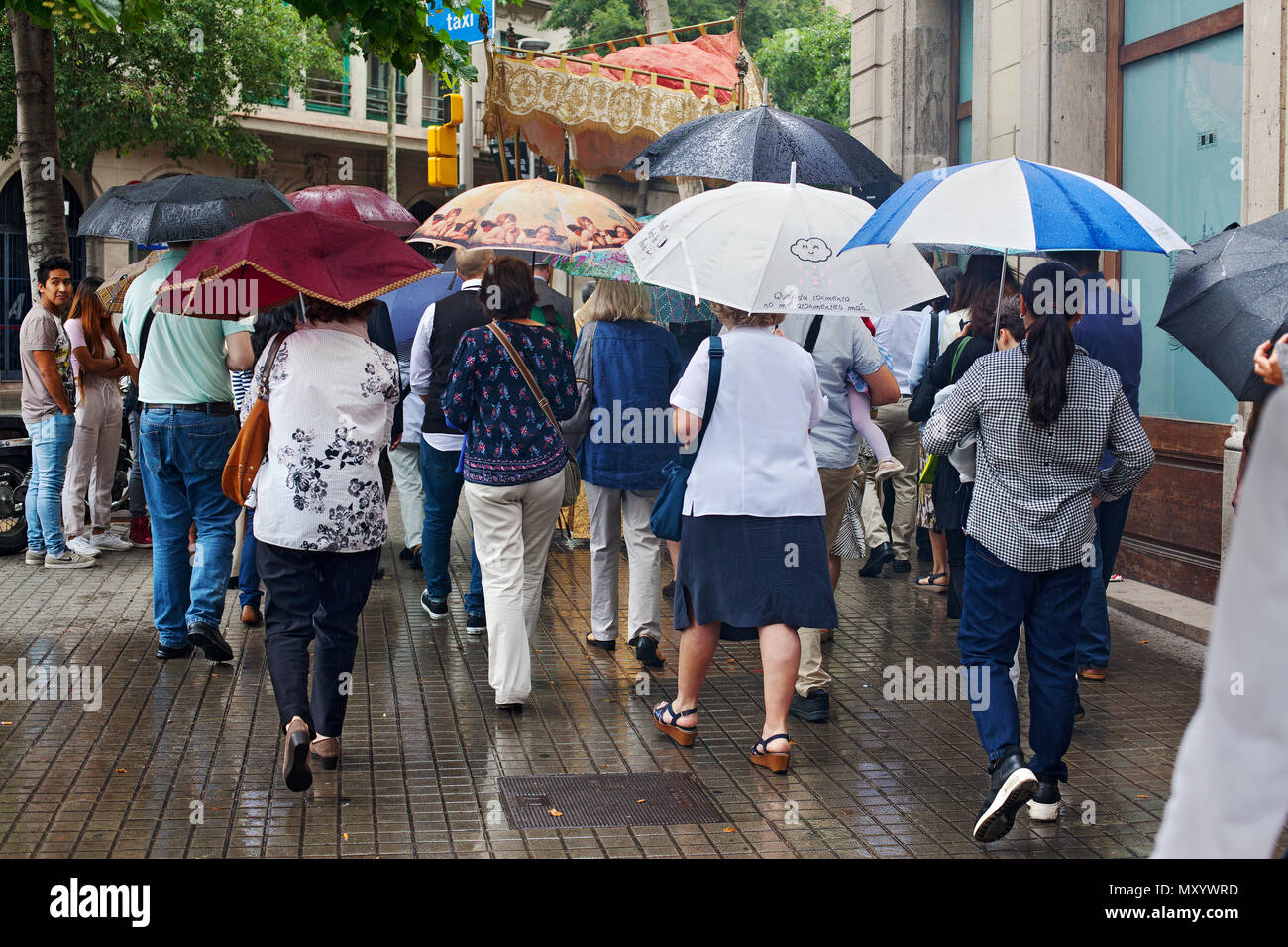 Catholic communion procession in the rain, Barcelona, Spain Stock Photo ...