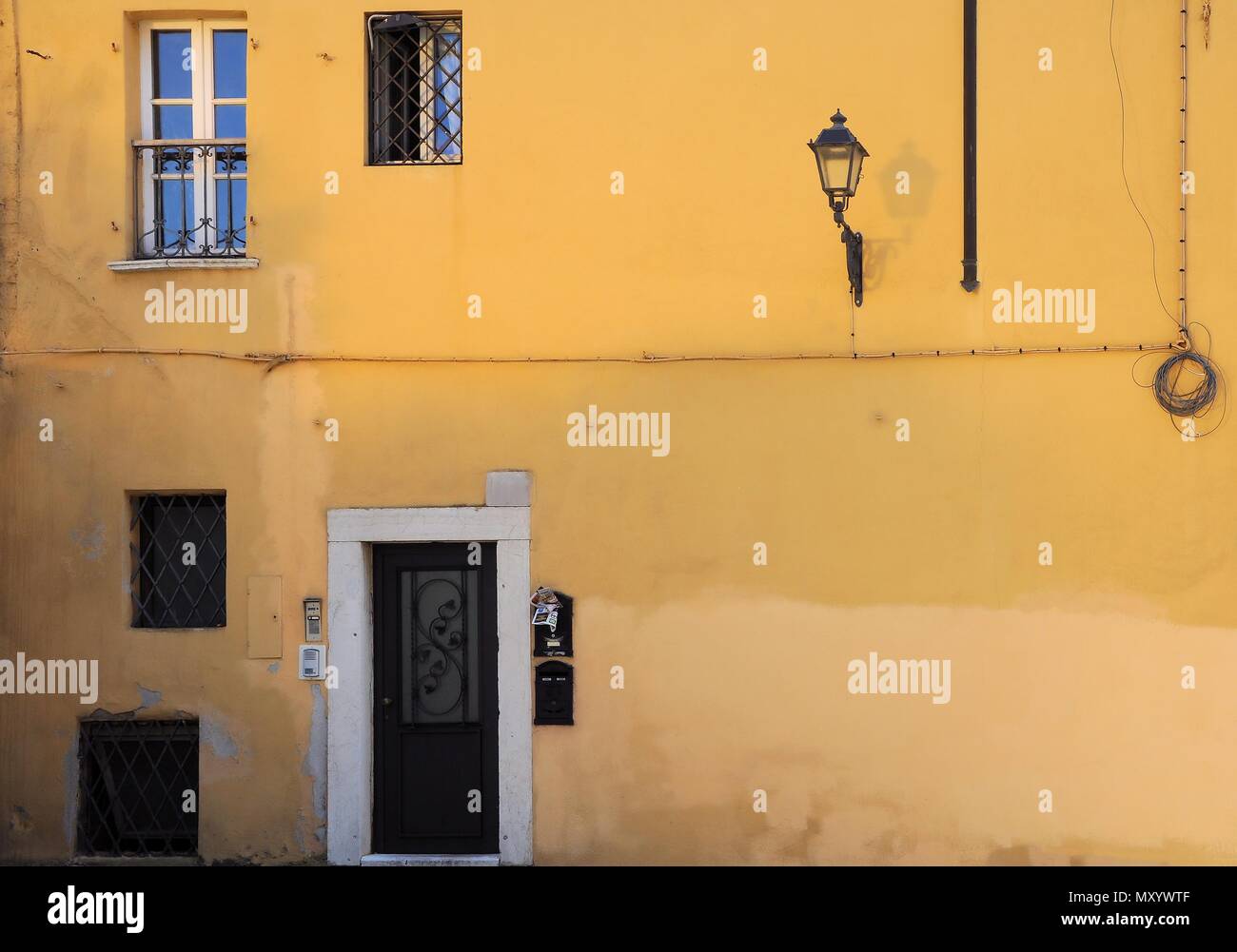 Old yellow building facade Stock Photo - Alamy