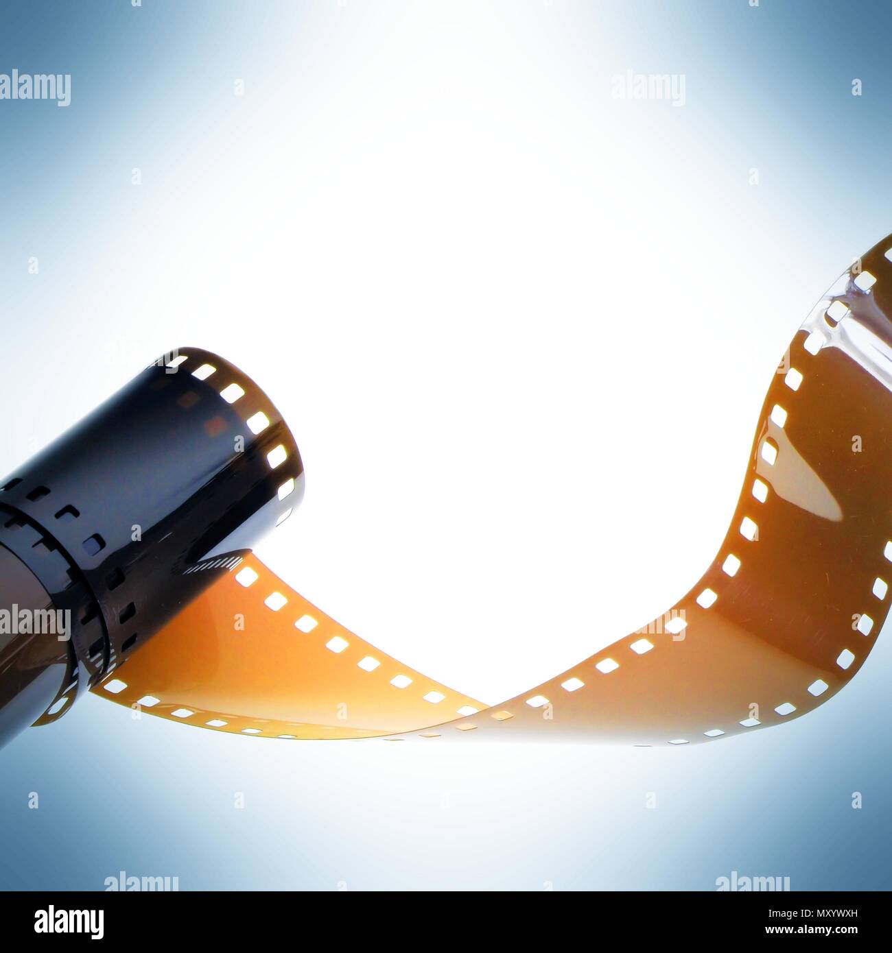 Twisted film strip on white and blue background Stock Photo - Alamy