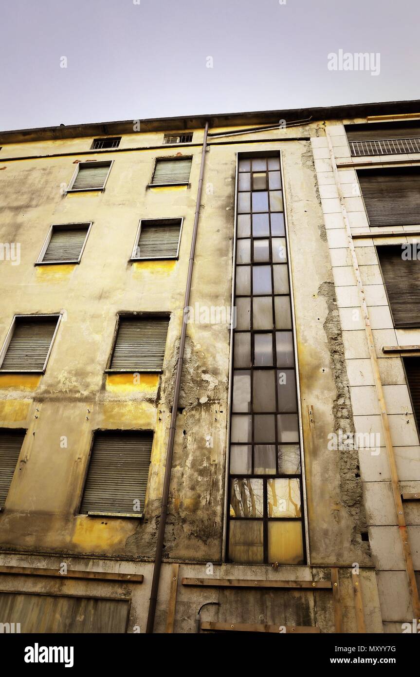 Vintage image of old and damaged facade of uninhabited building. Years ...
