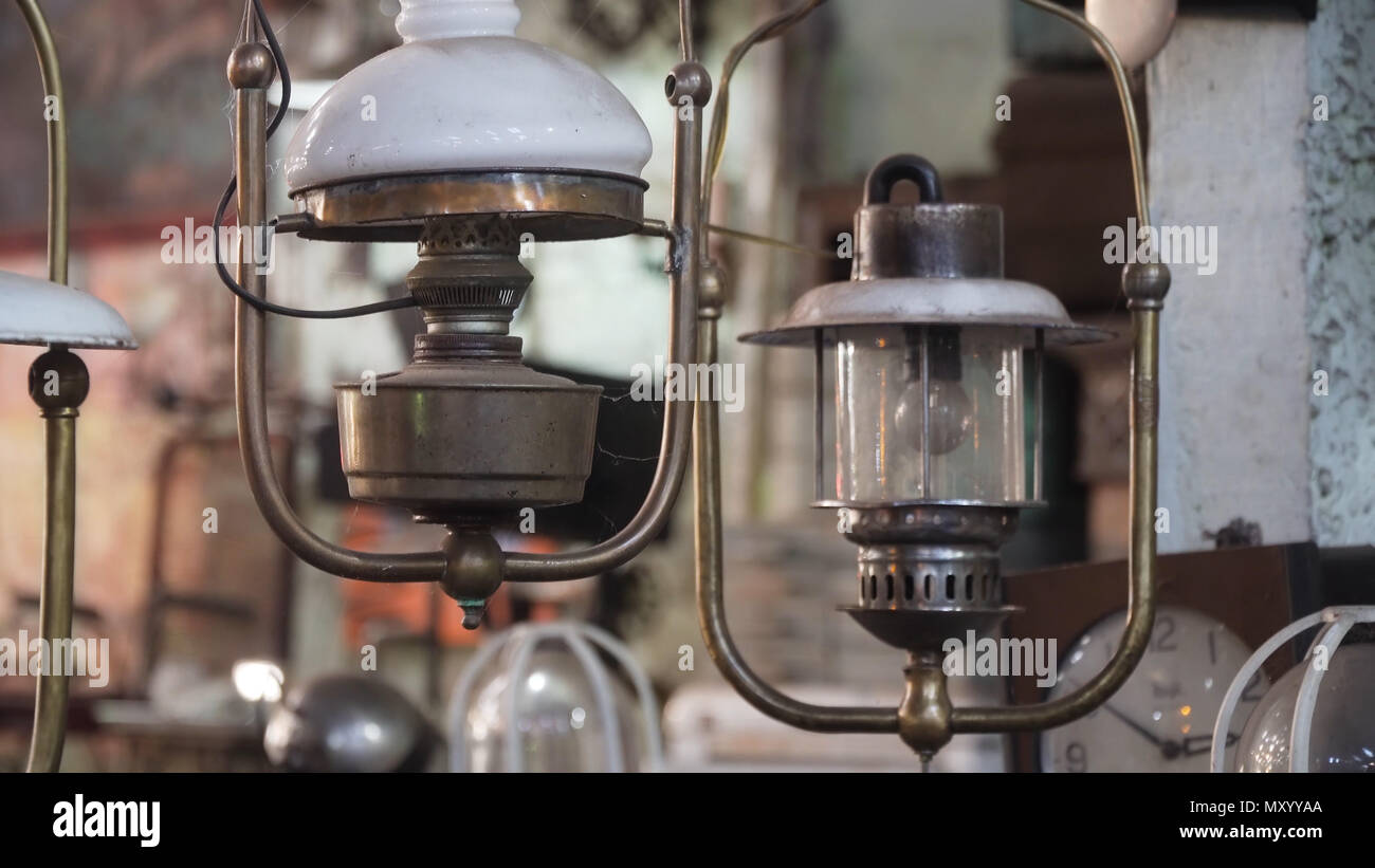 An old, vintage lamp with a shade in an antique store Stock Photo - Alamy