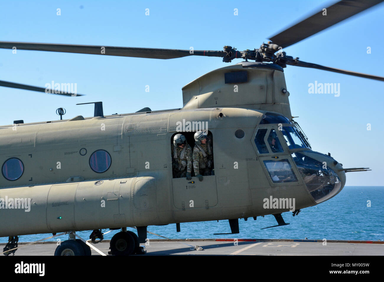 Kuwait- Crew chiefs from Bravo Company, 1st BN, 111th AVN REGT, watch ...
