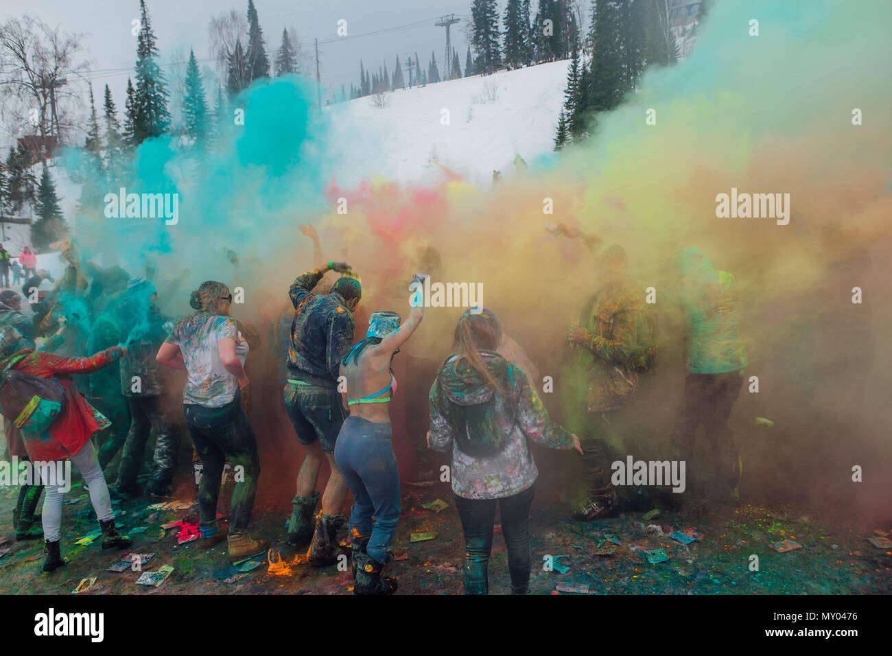 A group of a young people throwing colorful holi powder Stock Photo - Alamy