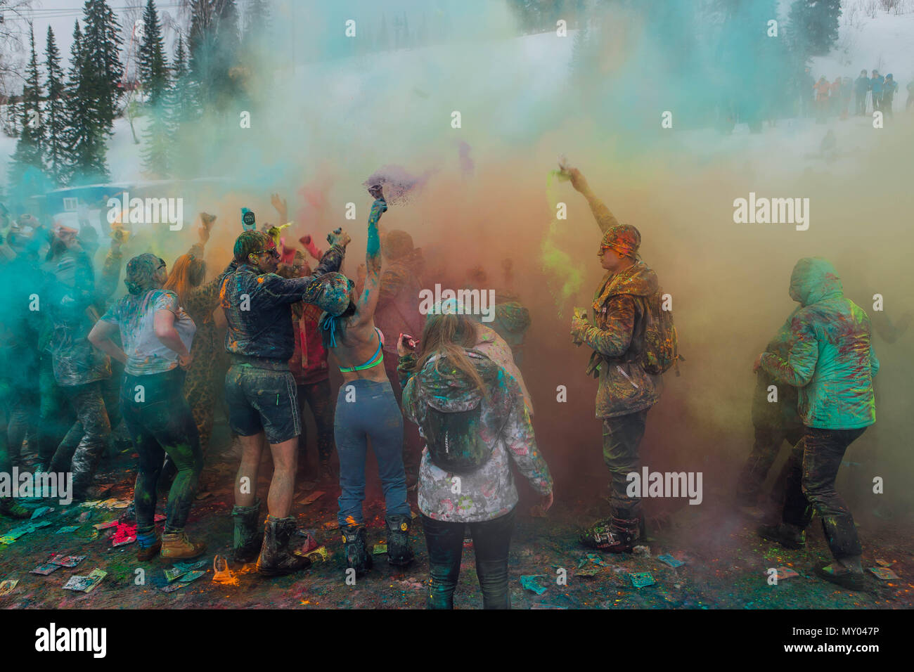 A group of a young people throwing colorful holi powder Stock Photo - Alamy