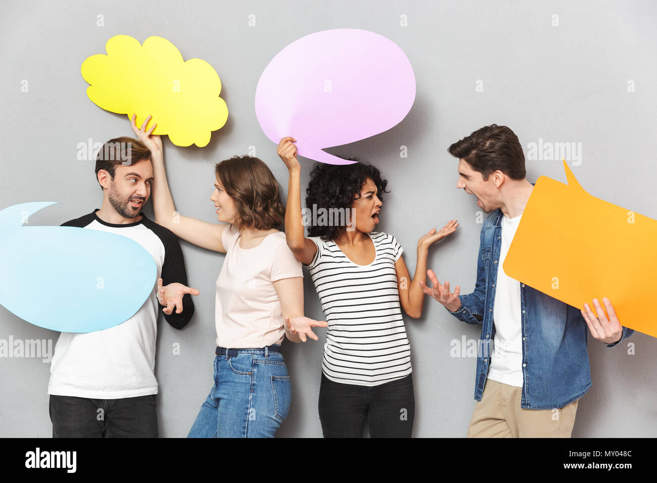 Image of screaming angry group of friends standing isolated over grey ...