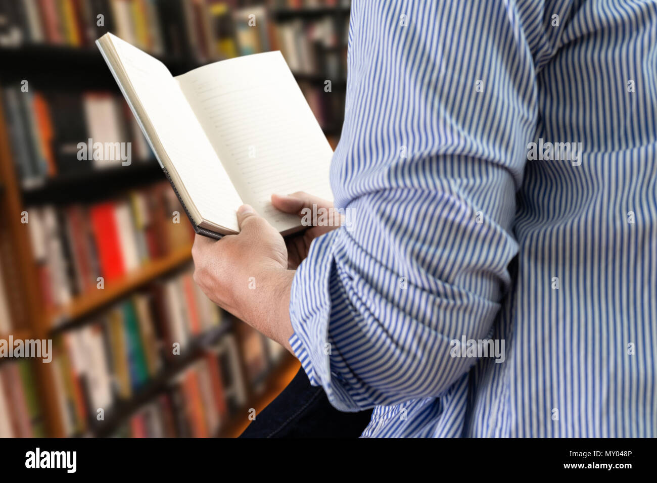 students reading book in library learning and education concept Stock ...