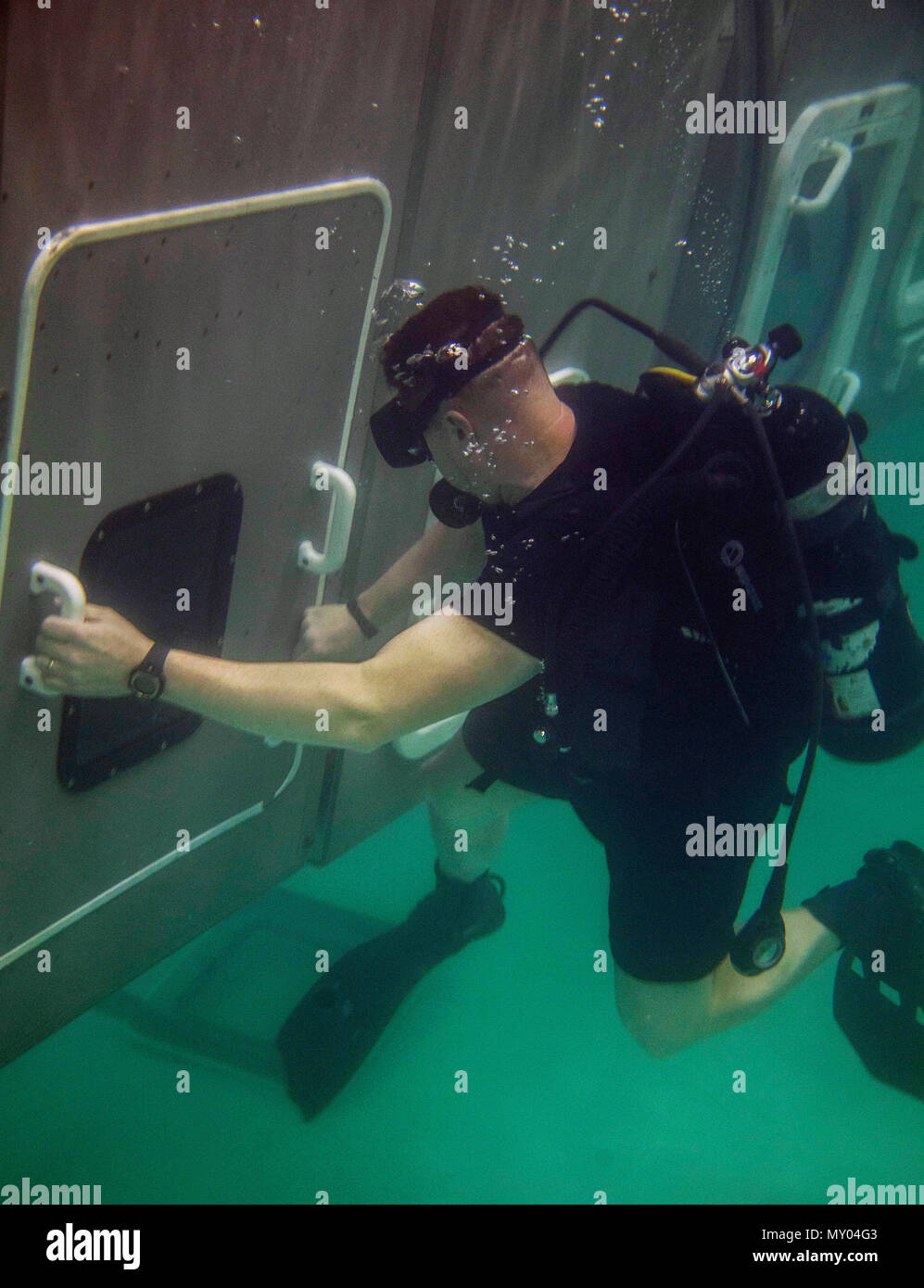An underwater training instructor with the Water Survival Training ...