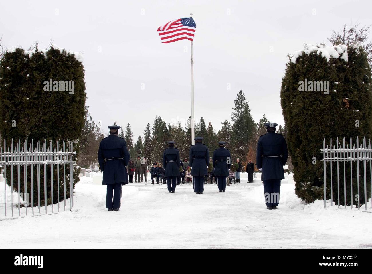 Fairchild Honor Guard Airmen stand at attention Dec. 19, 2016, during a ...