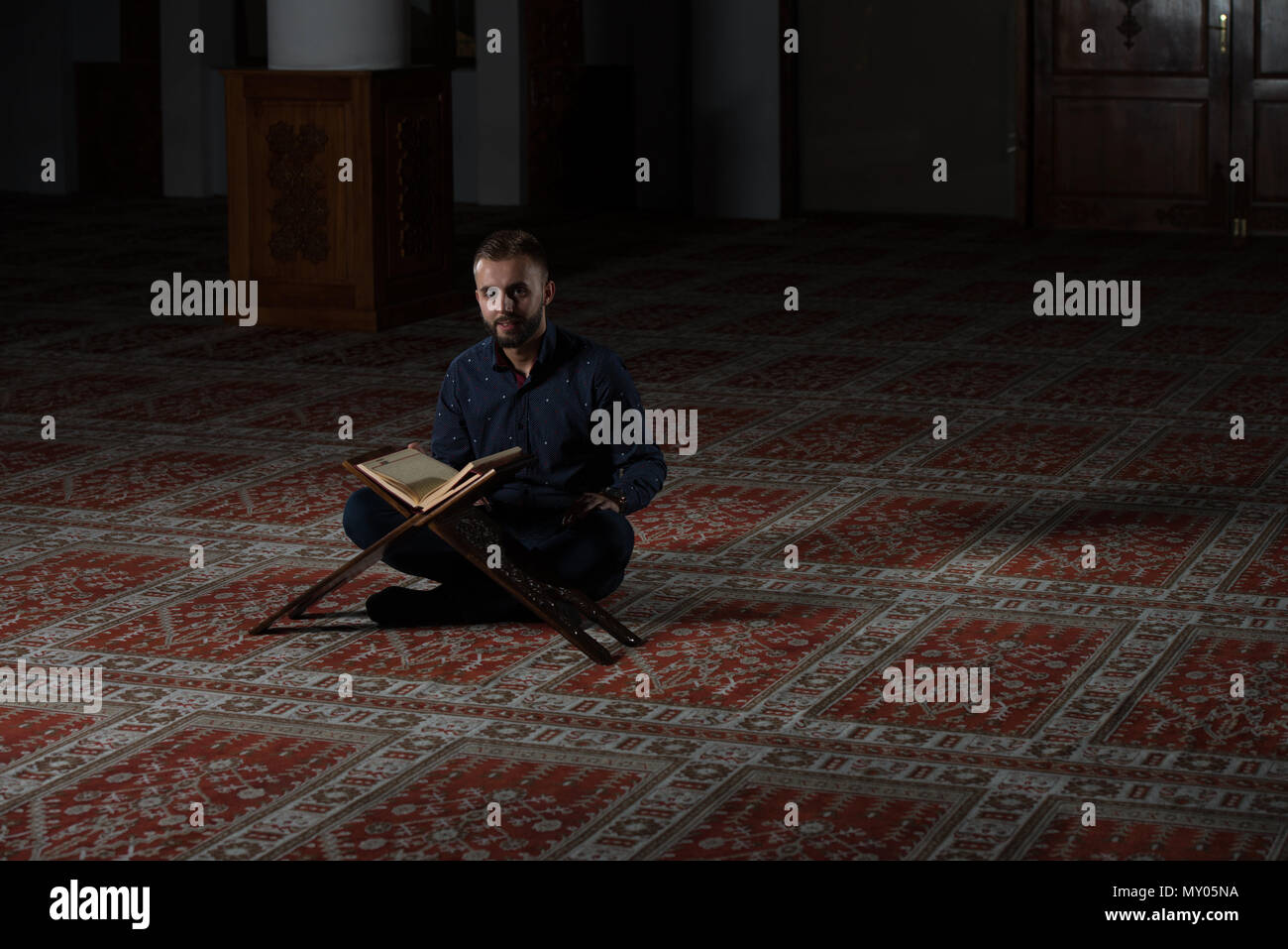 Humble muslim man reading koran hi-res stock photography and images - Alamy